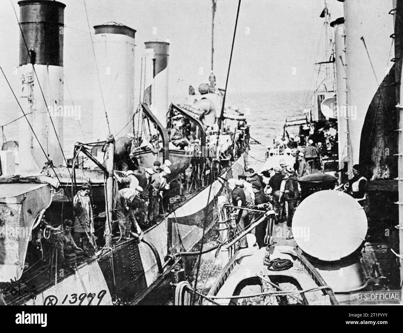 Taking on oil from USS ROE by USS WARRINGTON at sea, off the coast of ...