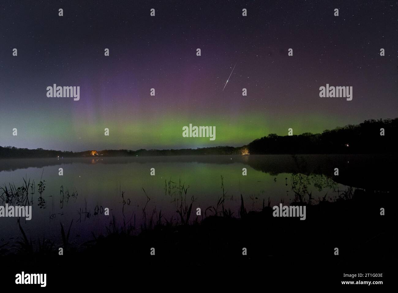 Northern lights reflection on a lake in Minnesota with a shooting star ...