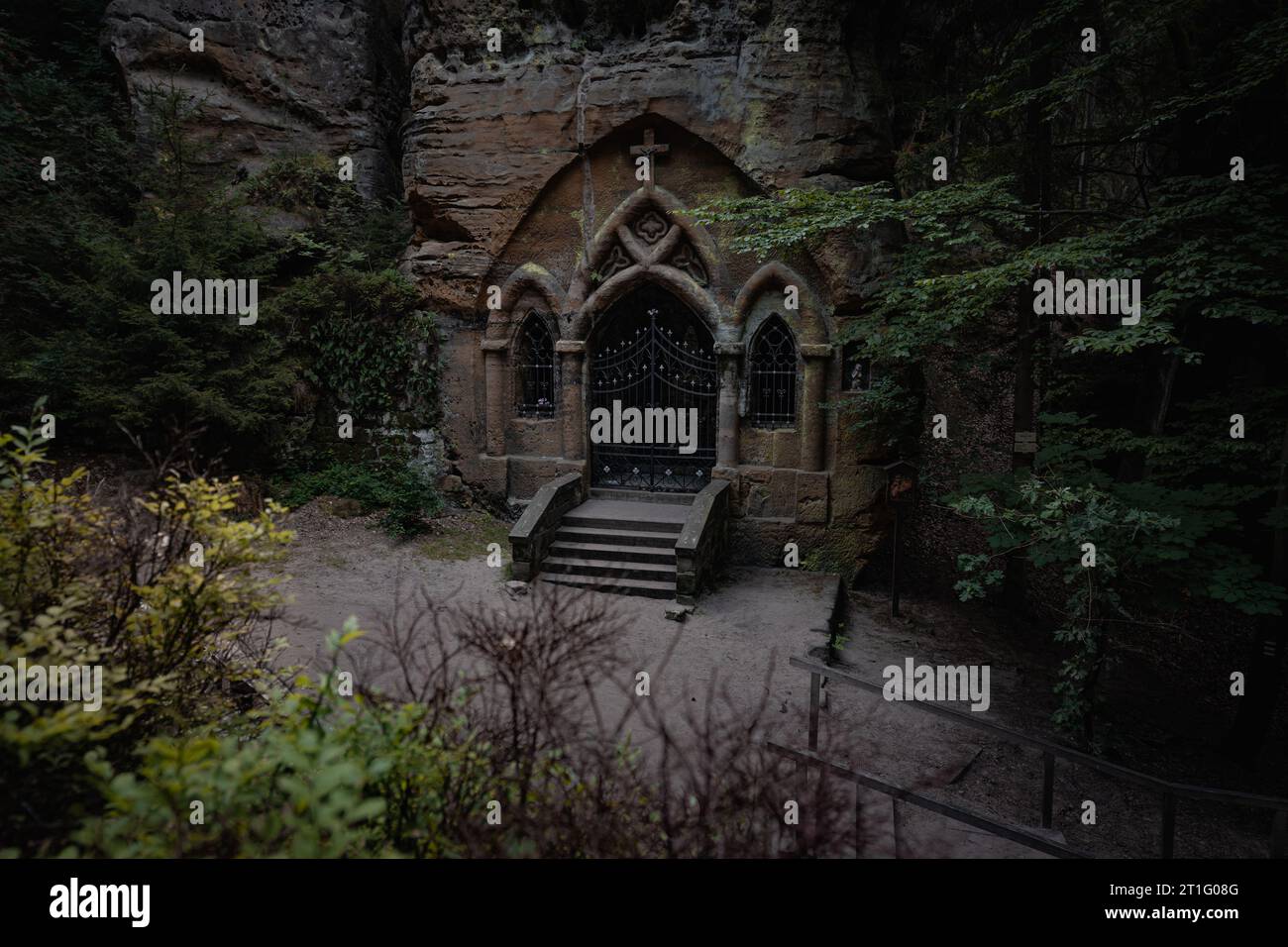 Ancient and abandoned rock chapel hidden in deep forest in the north ...