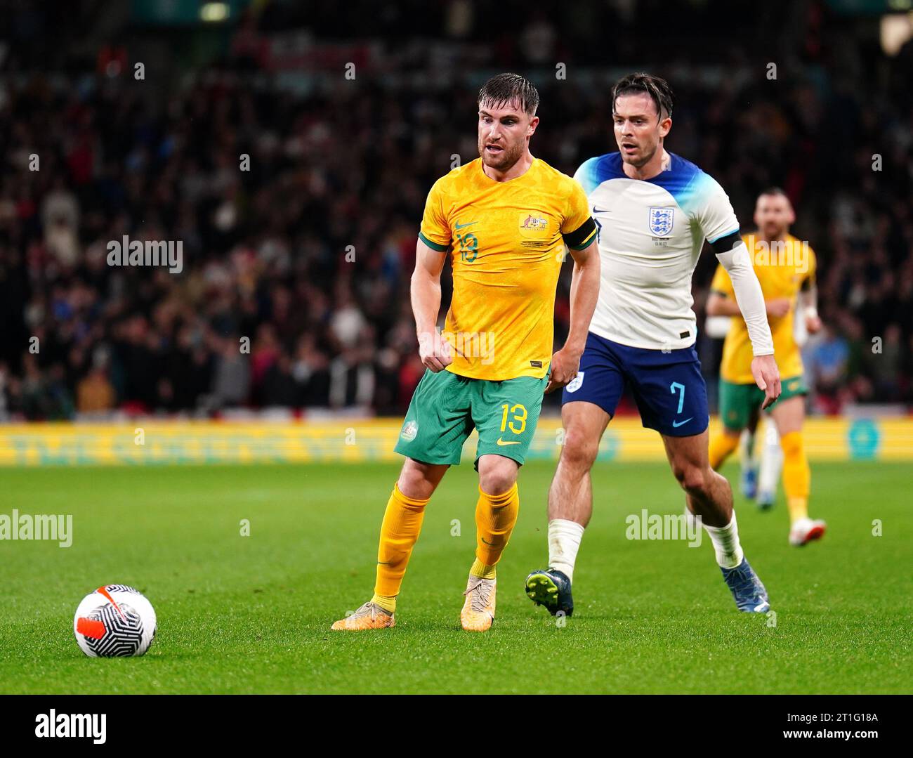 Australia's Ryan Strain (left) and England's Jack Grealish battle for ...