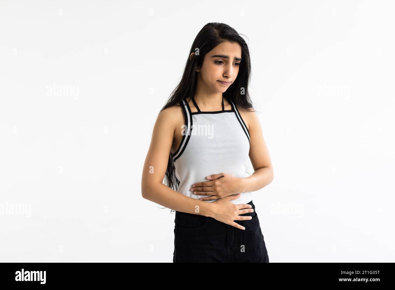 Asian woman unhappy looking sick, suffers from stomach ache stomachache ...