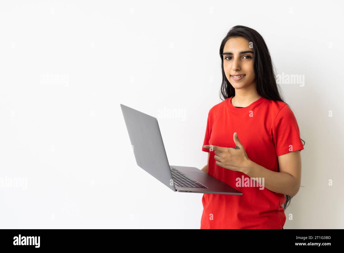 Indian businesswoman or employee using laptop on white background Stock ...