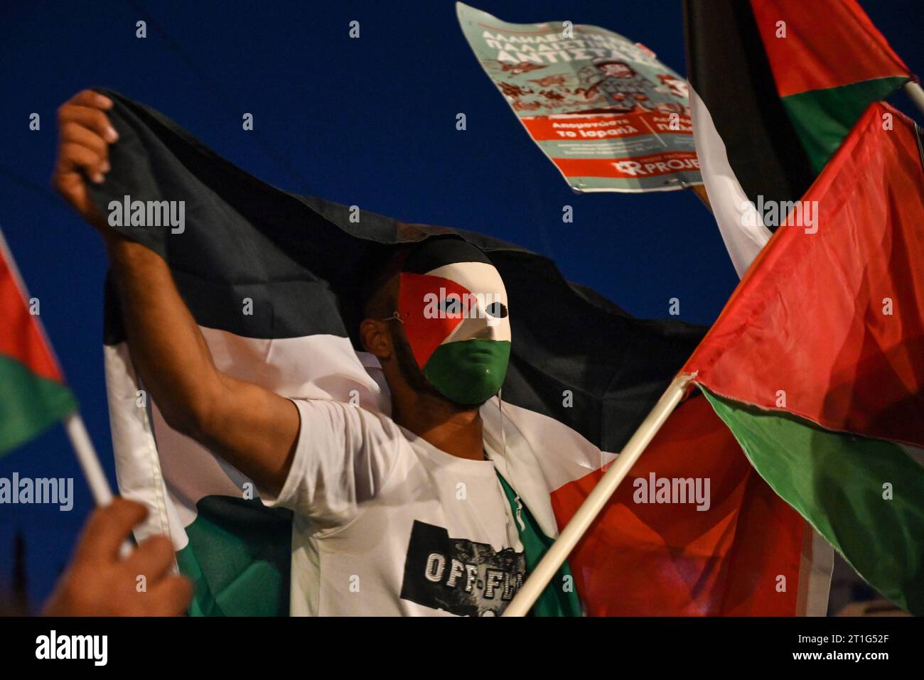 Pro-Palestinian demonstration A participant wearing a mask in the ...
