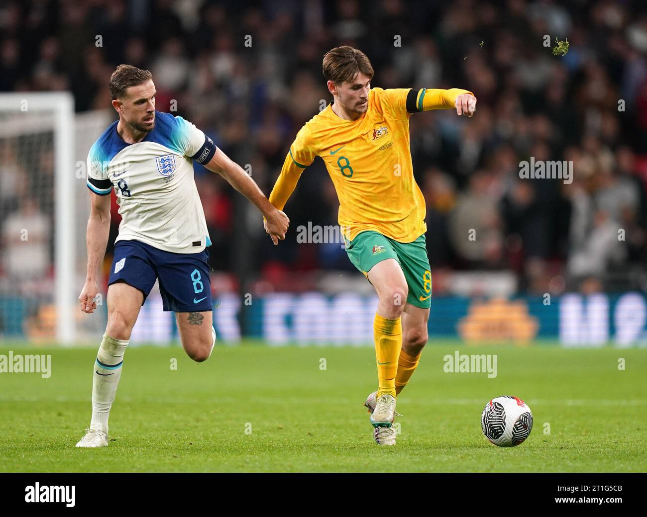 England's Jordan Henderson (left) and Australia's Connor Metcalfe ...