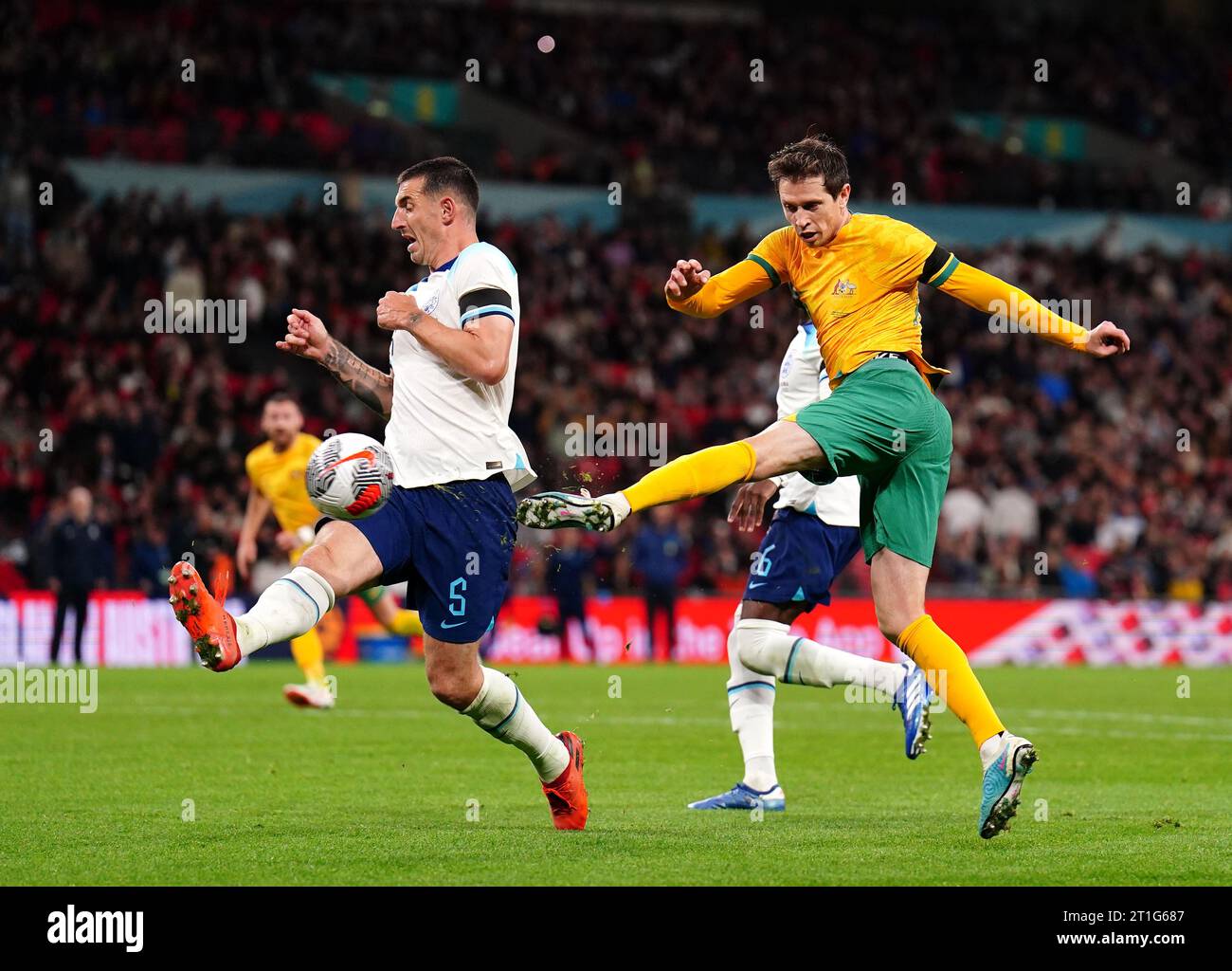 Australia's Craig Goodwin (right) attempts a shot on goal during the ...