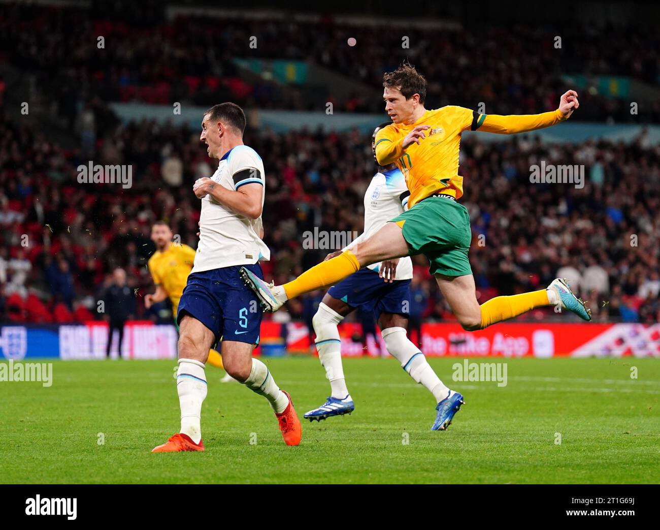 Australia's Craig Goodwin (right) attempts a shot on goal during the ...