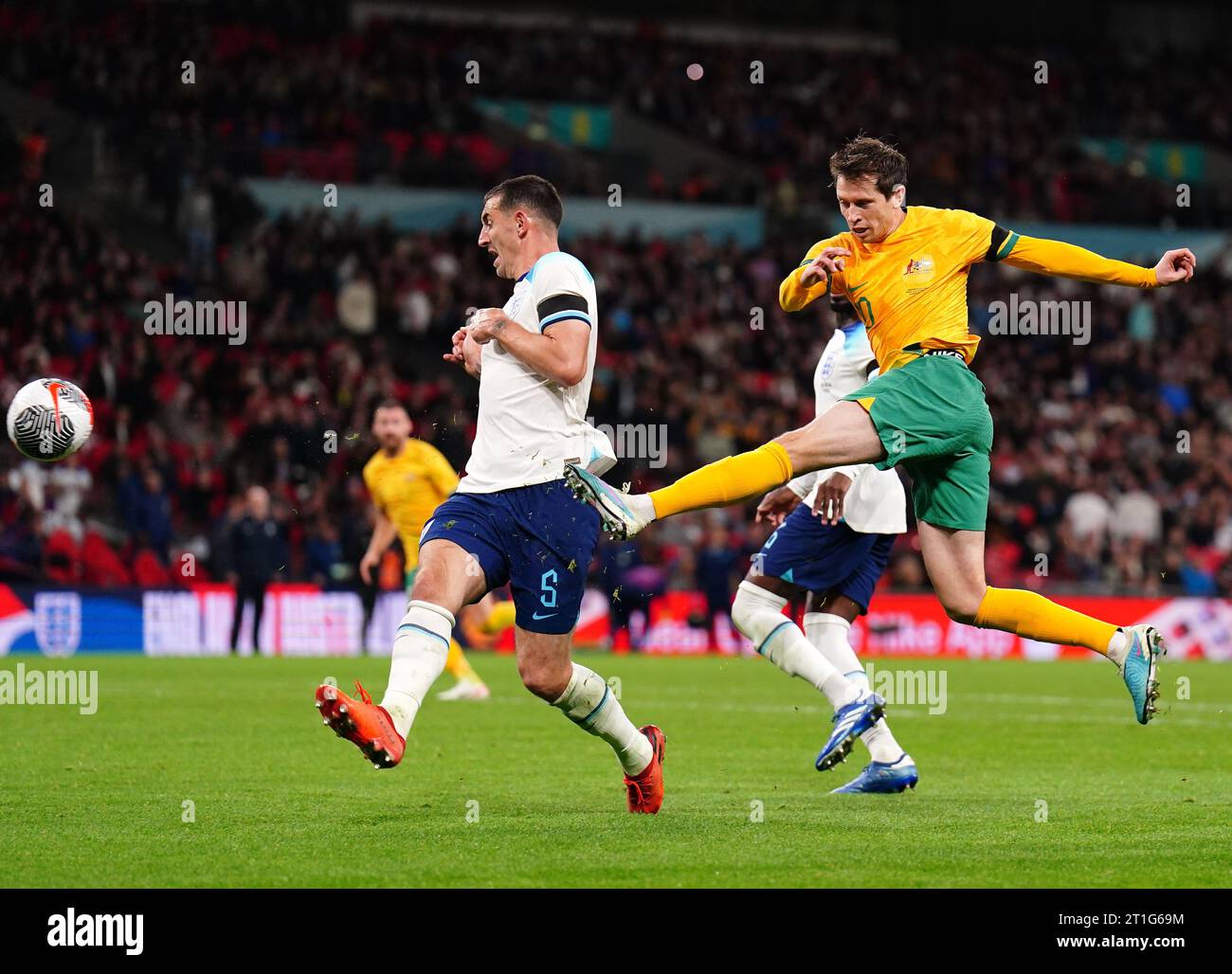 Australia's Craig Goodwin (right) attempts a shot on goal during the ...