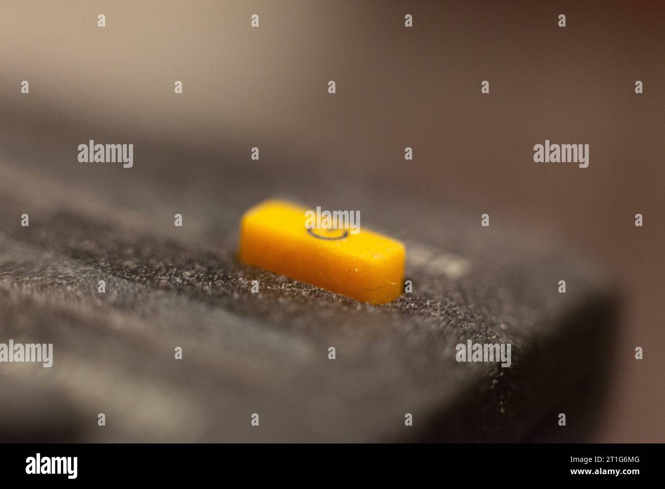 The corner edge of a remote control and its power on/off button Stock ...