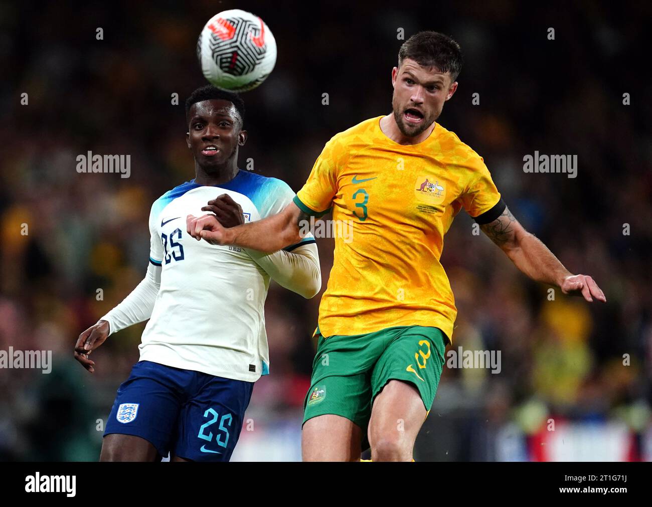 England's Eddie Nketiah (left) and Australia's Cameron Burgess battle ...