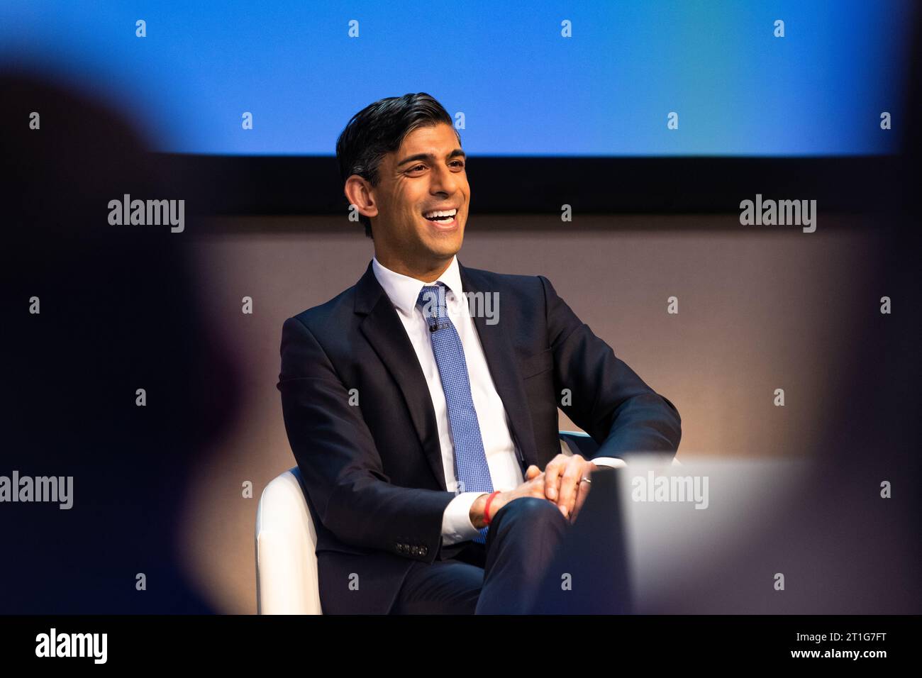 Rishi Sunak seated smiling 2023 Stock Photo - Alamy
