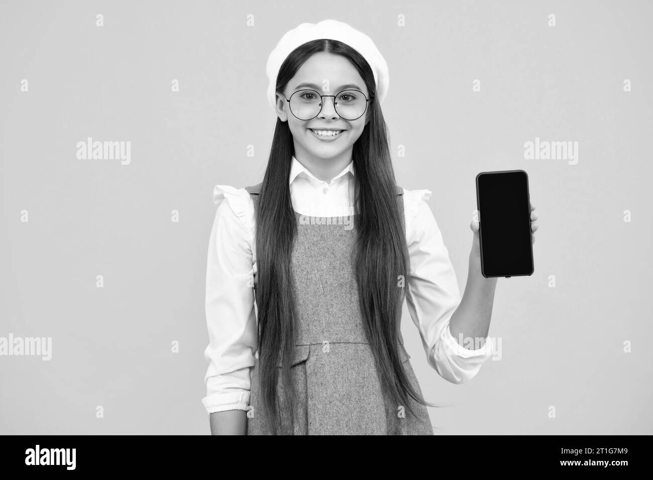 Mobile online shopping. Cute teen child girl paying with phone, texting ...