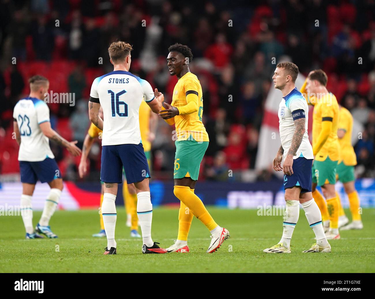 England's John Stones greets Australia's Mohamed Toure following the ...