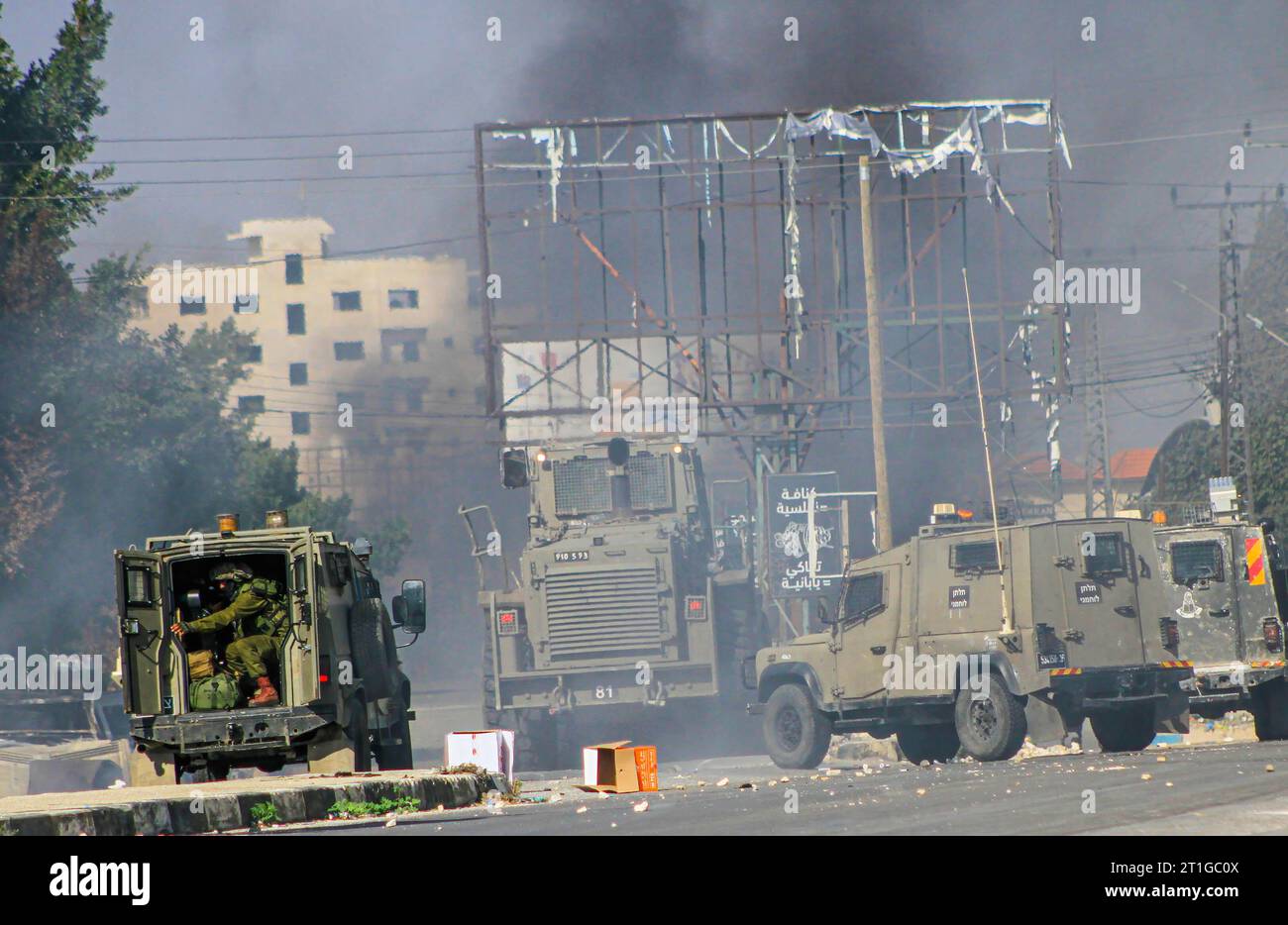 Military vehicles and bulldozers pursue Palestinian demonstrators to ...