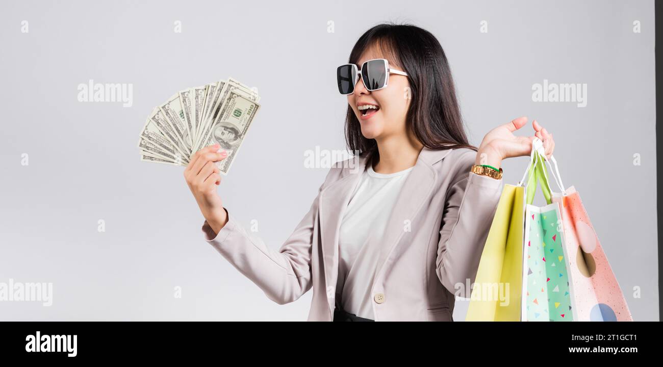 Woman with glasses confident shopper smile holding online shopping bags ...
