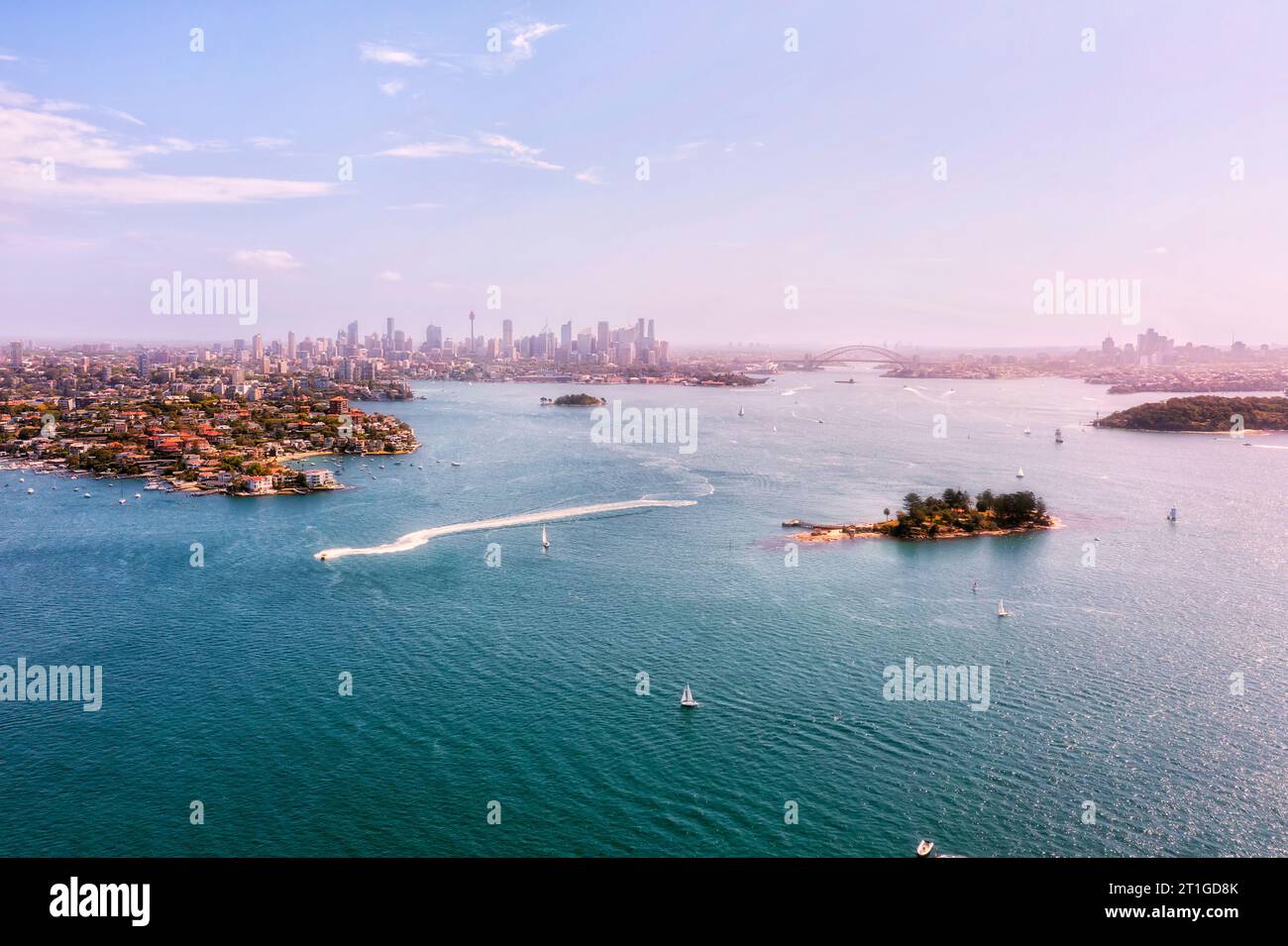 Shark island on Sydney Harbour off Rose bay in aerial cityscape view to ...