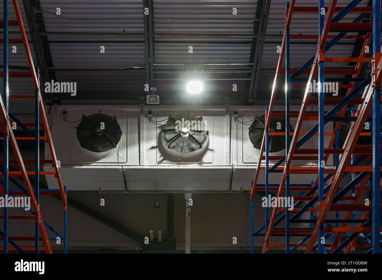 A three -fan industrial refrigeration evaporator in the freezer at an ...