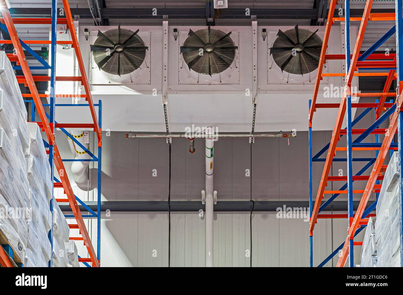 A three -fan industrial refrigeration evaporator in the freezer at an ...