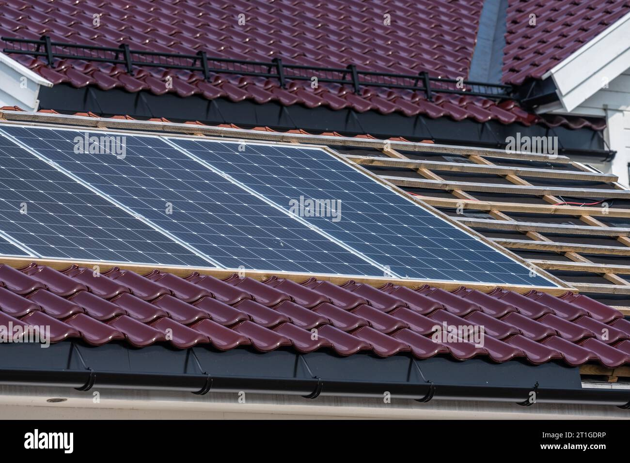 Rooftop solar cells under installation Stock Photo - Alamy
