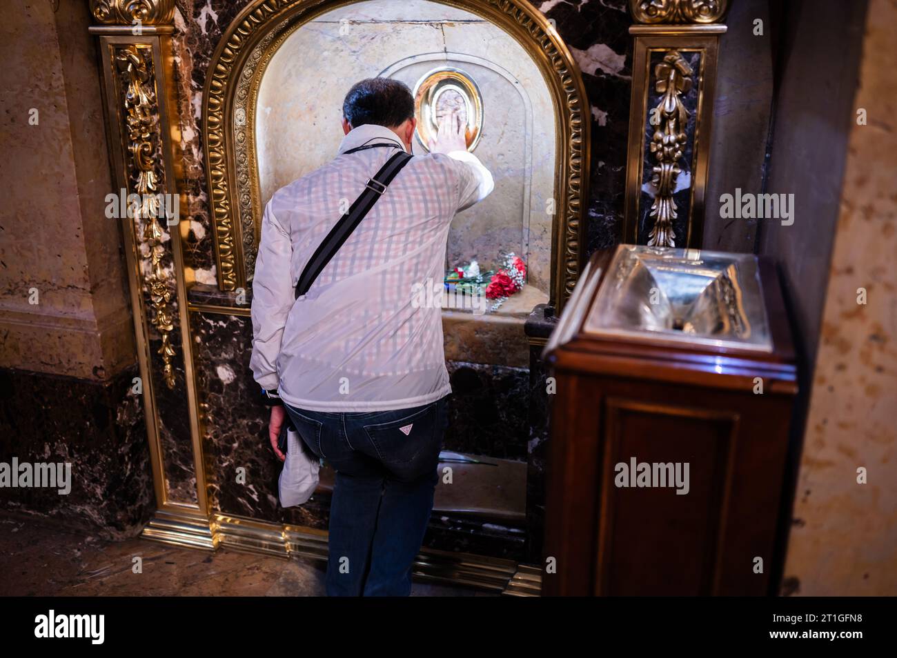 Worshipers kissing the pillar inside the Cathedral-Basilica of Our Lady ...