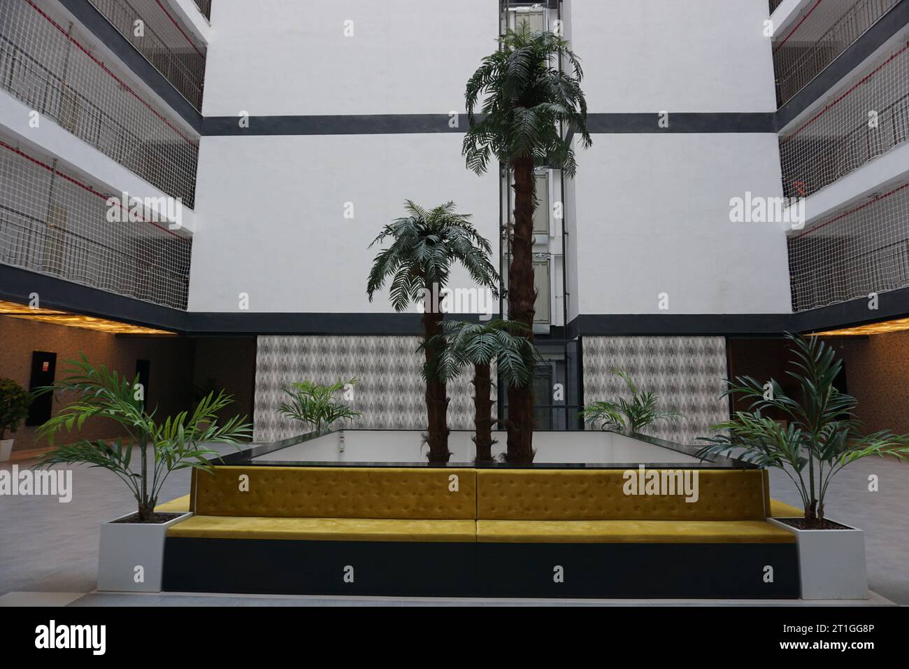 Seating area in the lobby. ornamental trees in the lobby. seating area ...
