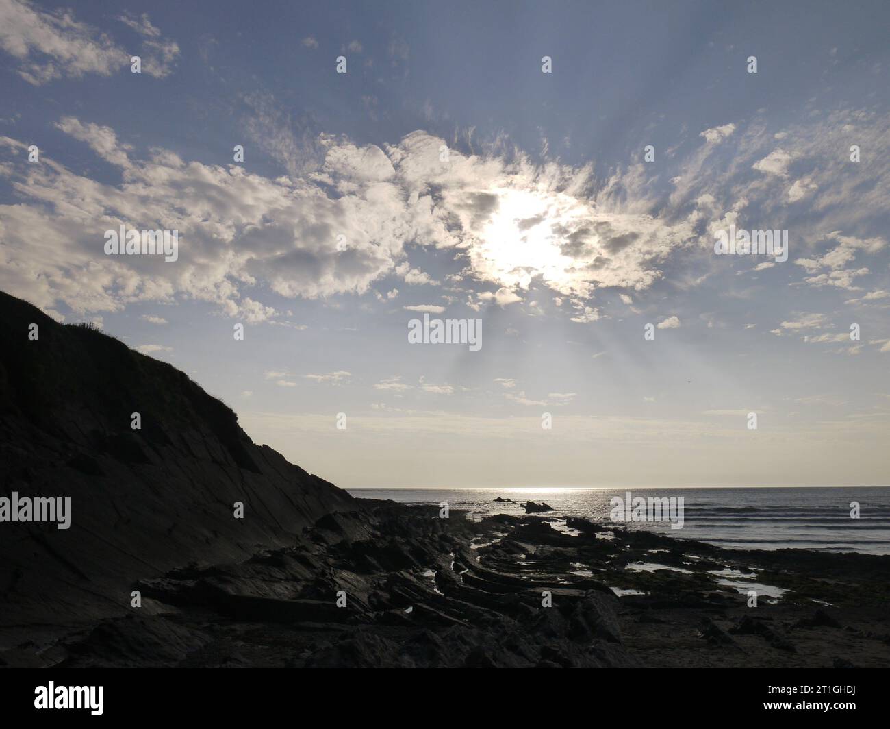 Crackington Haven, Cornwall, UK - June 24 2023: Crepuscular rays over ...