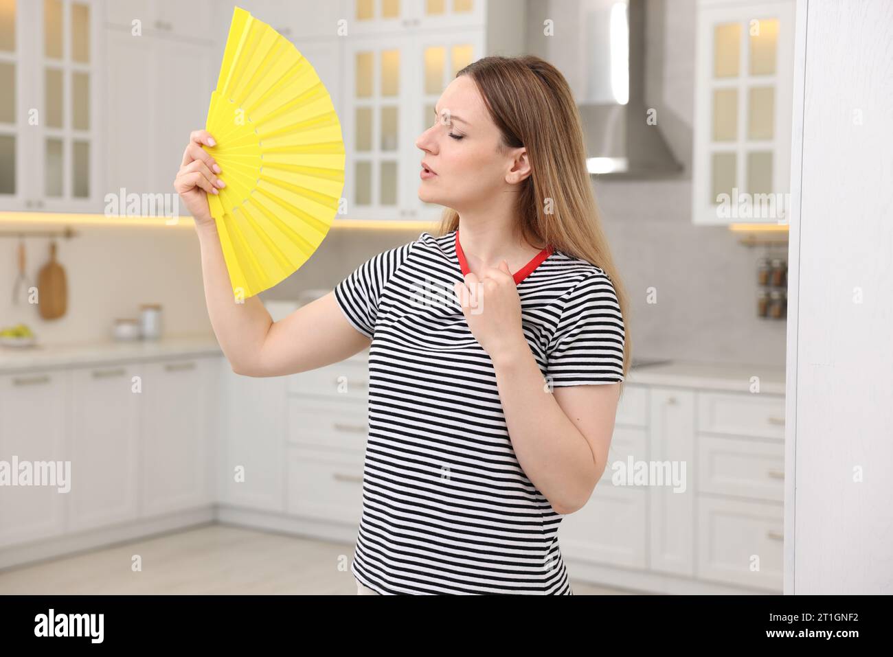 Woman fanning herself in the heat hi-res stock photography and images ...