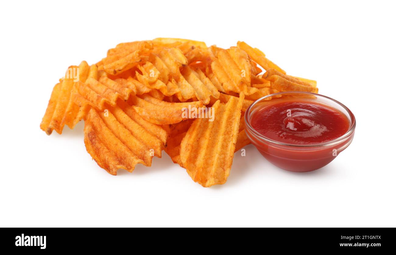 Delicious ridged chips with ketchup on white background Stock Photo - Alamy
