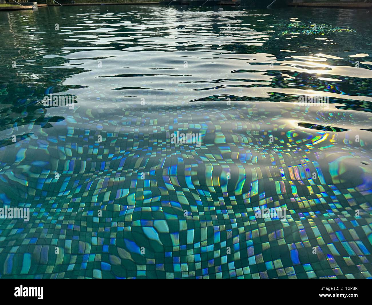 Clear rippled water in outdoor swimming pool Stock Photo - Alamy