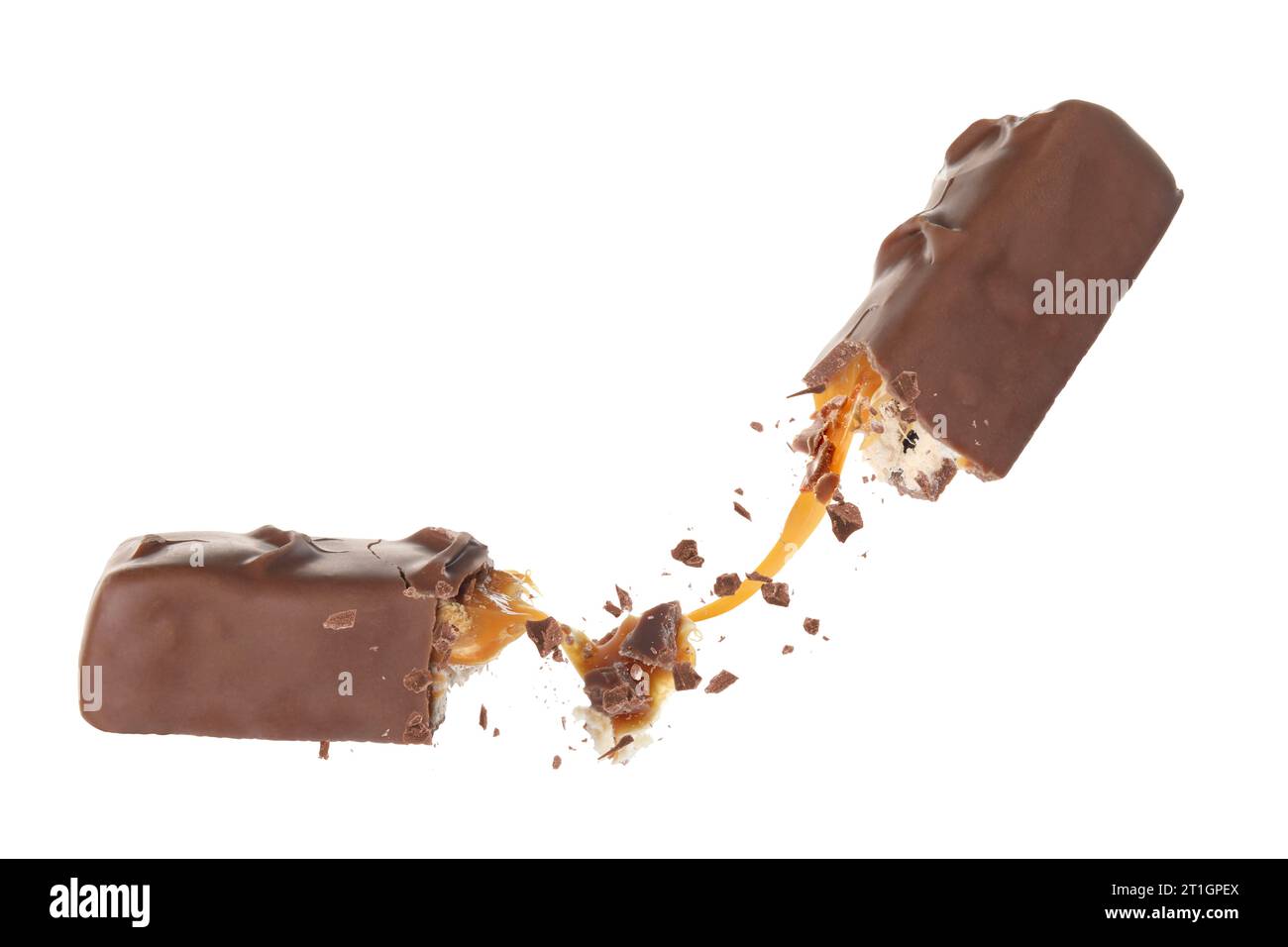Broken chocolate bar with yummy caramel in air on white background ...