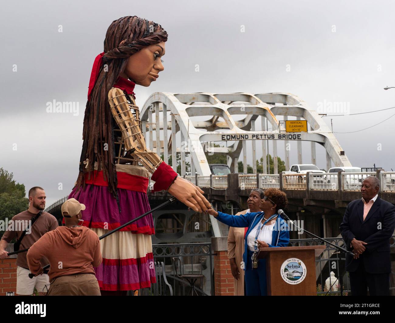 Selma, Alabama, USA. 13th Oct, 2023. JOANNE. BLAND and LINDA LOWRY shake hands with Little Amal ...