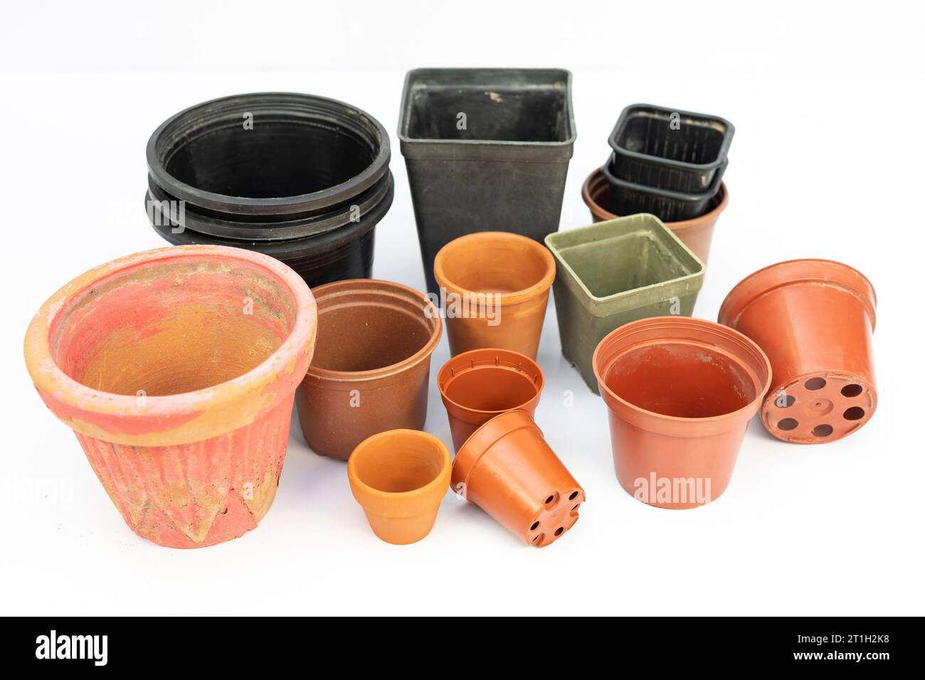 Various sizes, shapes and designs of plastic pots for plants isolated ...