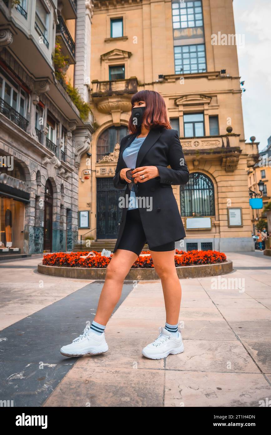 Fashion photo shoot of the new normal, an enterprising young brunette ...