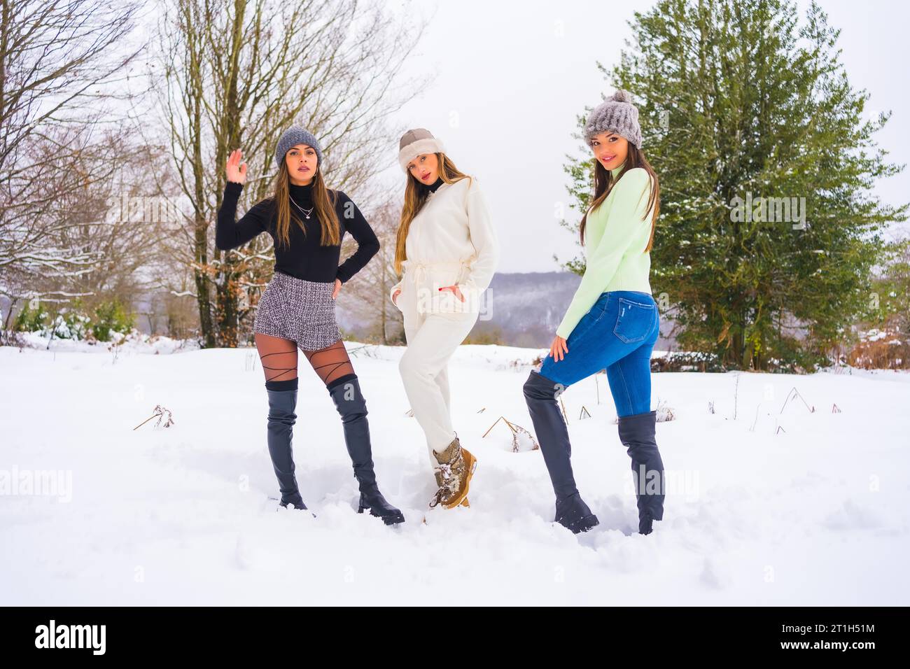 Winter lifestyle, three caucasian friends with winter outfit and wool ...