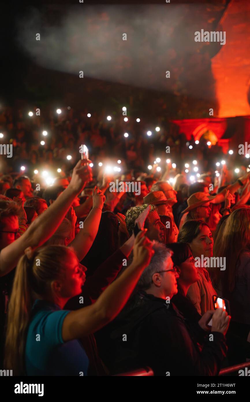 Crowd with mobile phone lights at Live Klostersommer Festival in ...