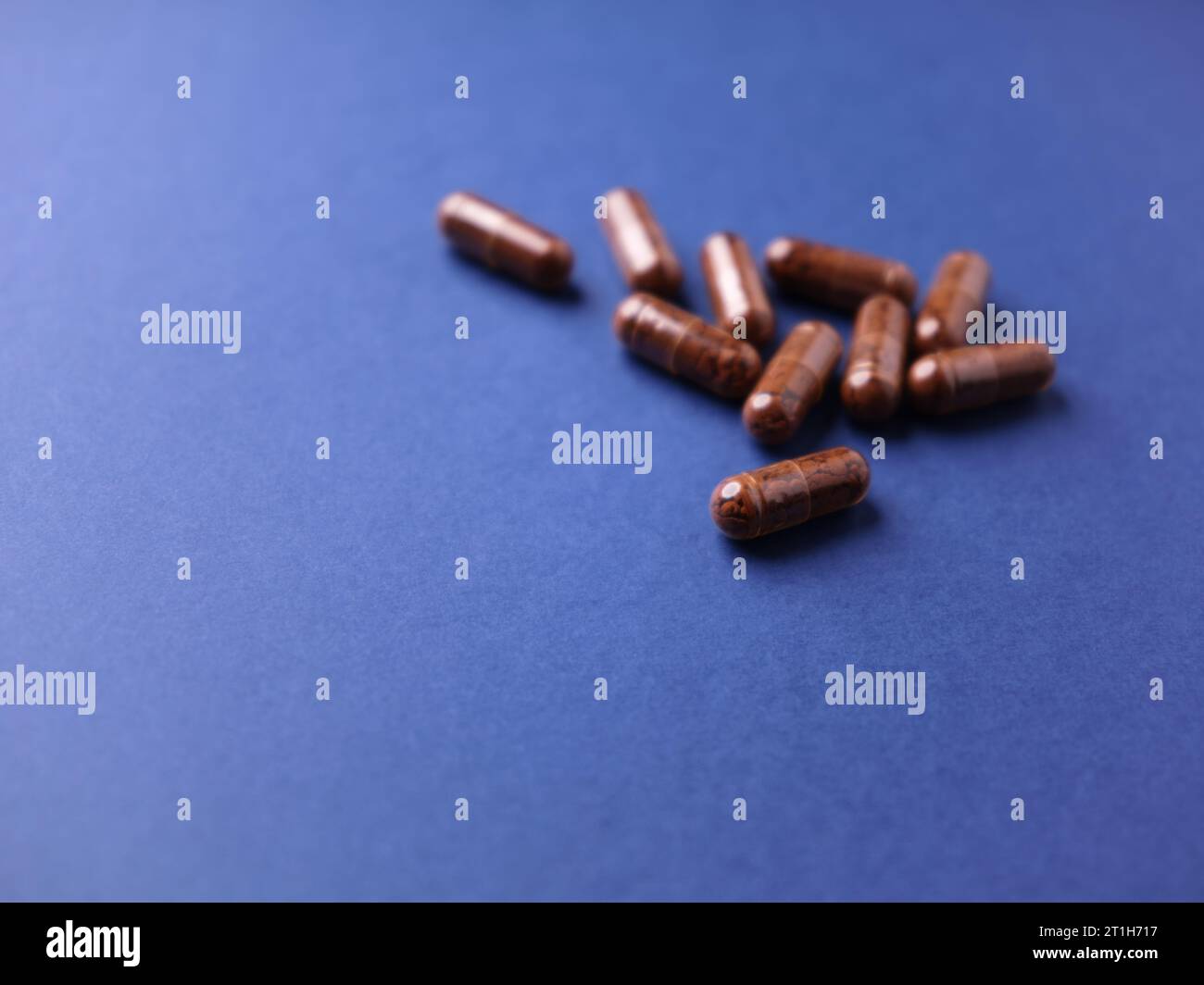 Ashwagandha (Withania somnifera) capsules. Paper background. Soft focus ...