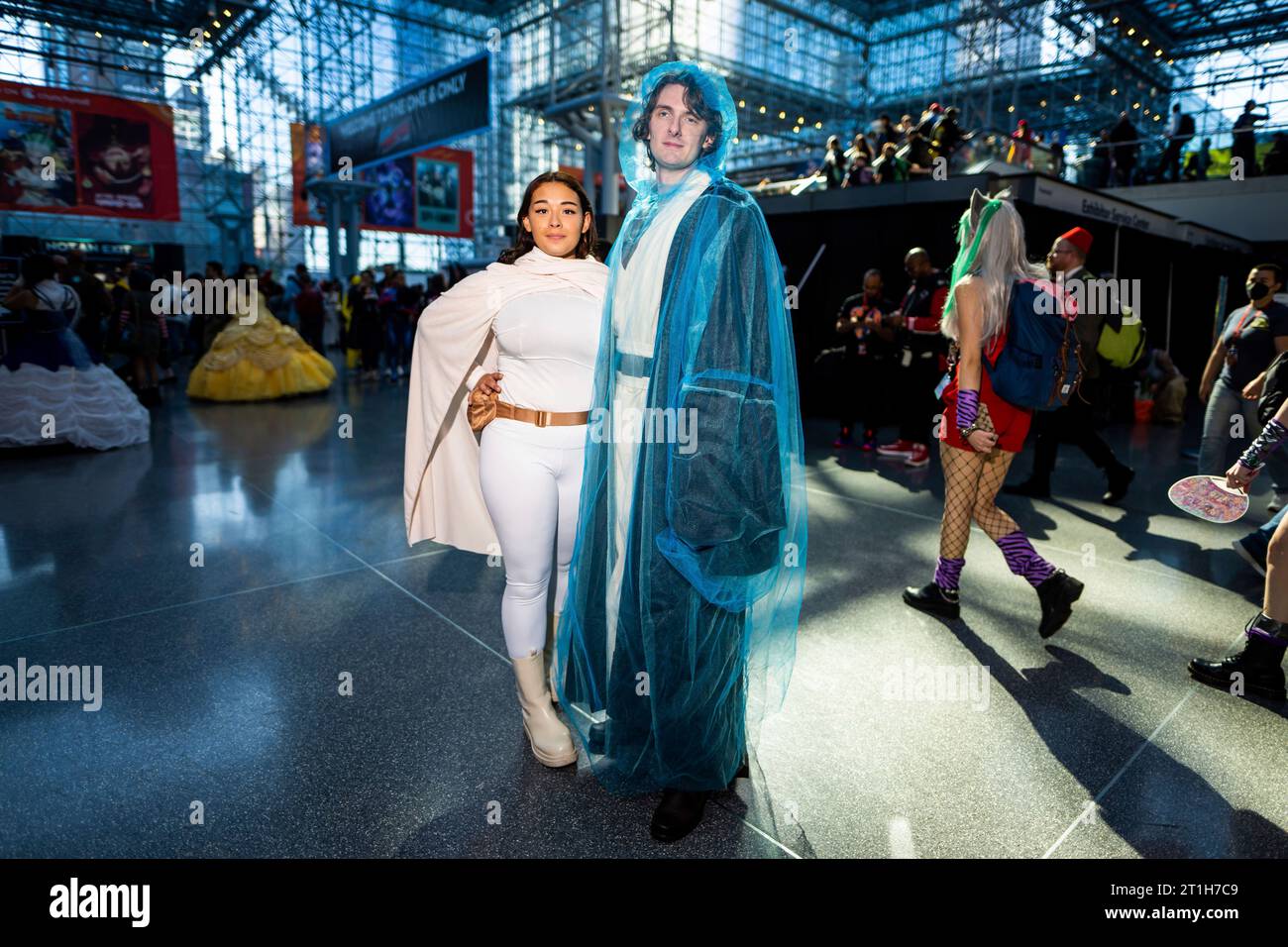Attendees dressed as Princess Leia and ghost Anakin Skywalker from Star ...