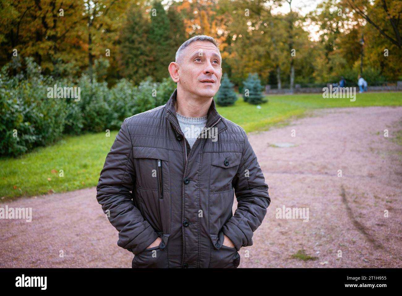 Lonely man in jacket stands hi-res stock photography and images - Alamy