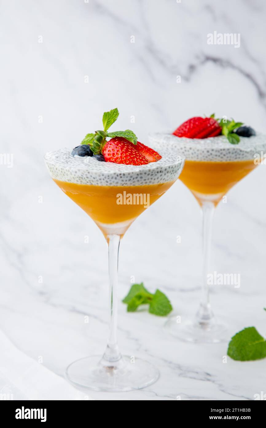 exotic fruit cocktails with berries and chia seed topping and mint side ...