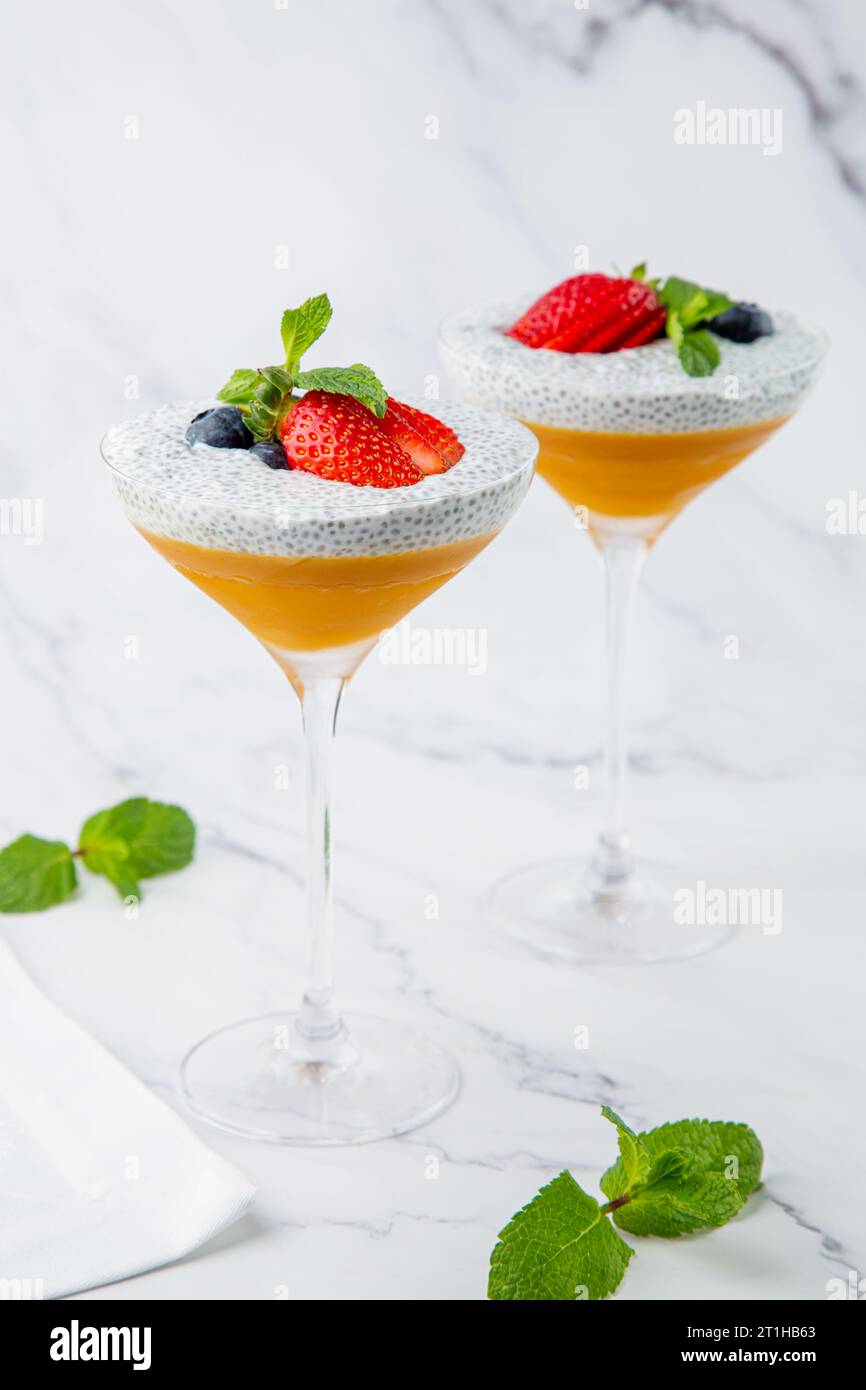 exotic fruit cocktails with berries and chia seed topping and mint side ...