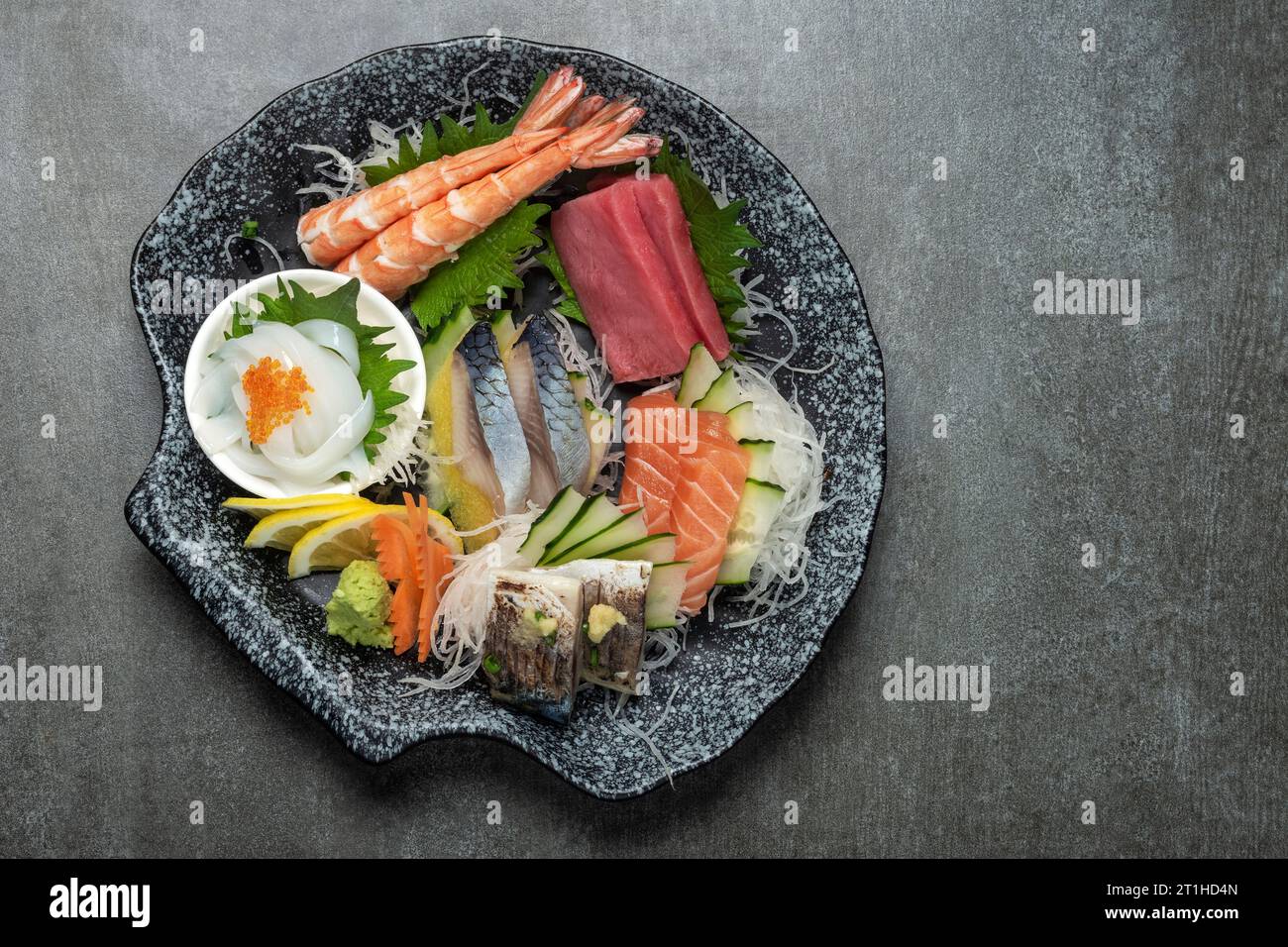 mixed sashimi sushi plate in japanese restaurant on grey background ...