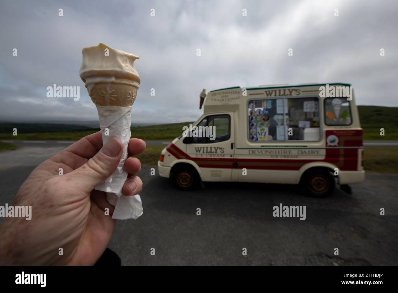Hand holding ice cream cone and ice cream van, Dartmoor National Park ...