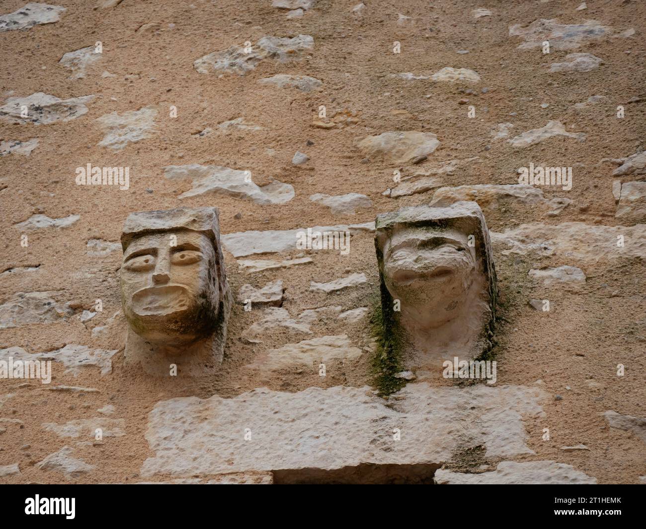 Modillions, human face sculptures on the church facade in Payroux ...