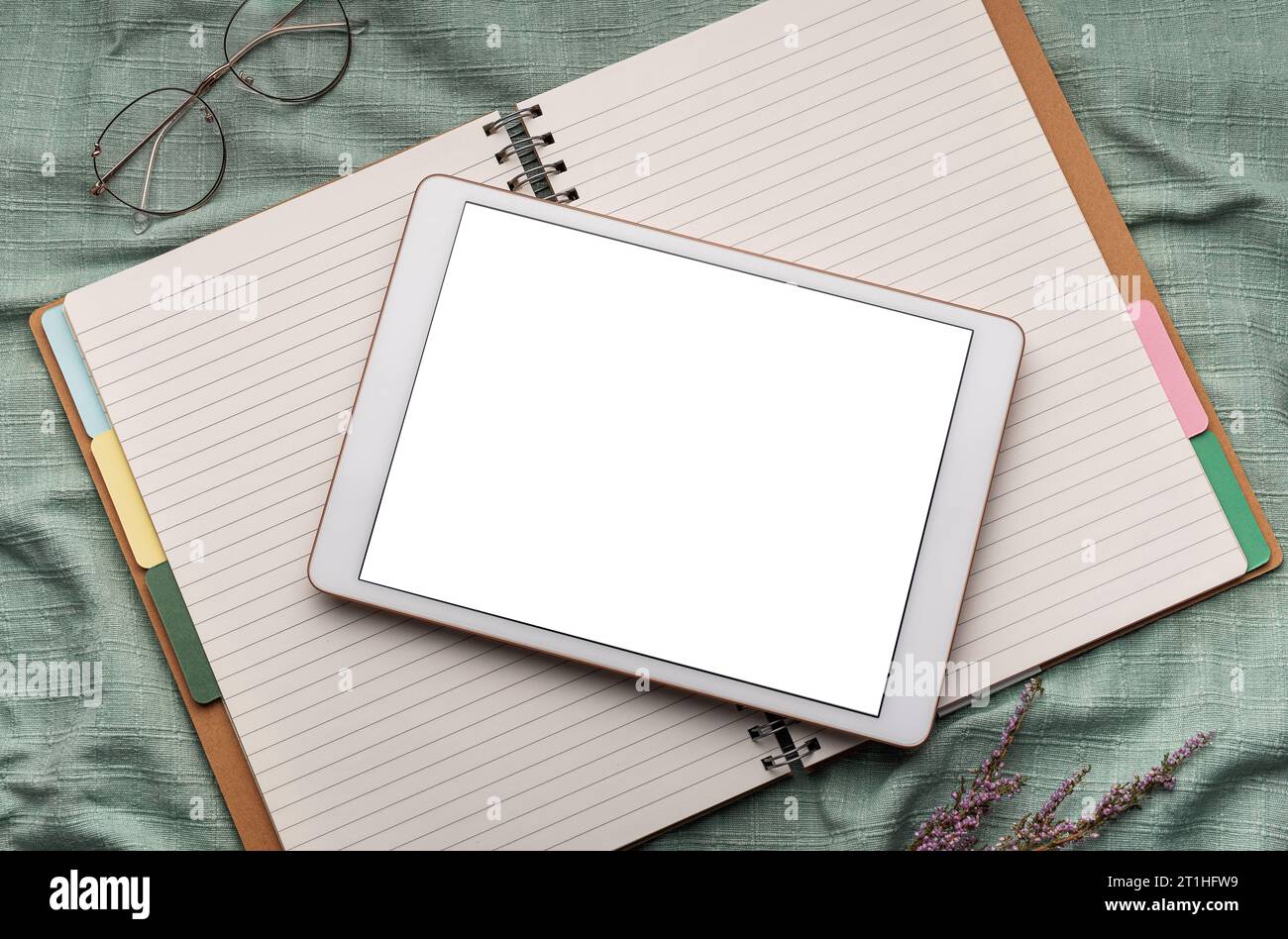 Tablet empty white screen and notebooks on the office desk Stock Photo ...