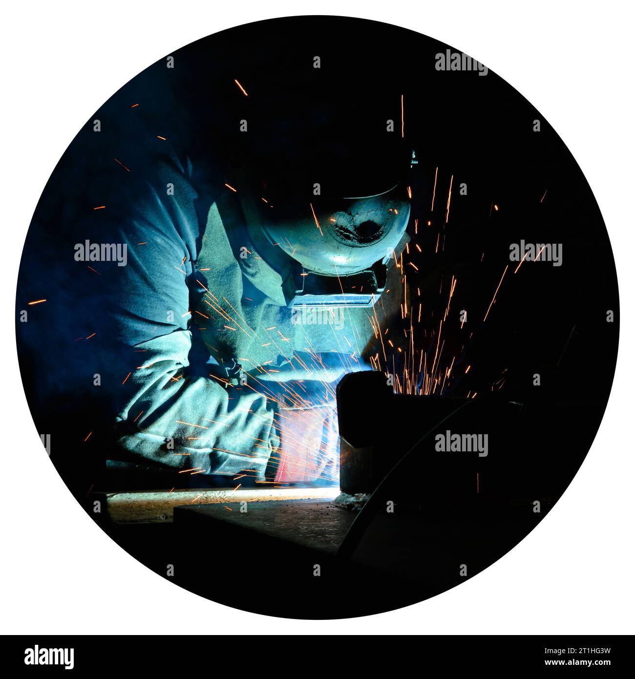 Welder uses torch to make sparks during manufacture of metal equipment ...