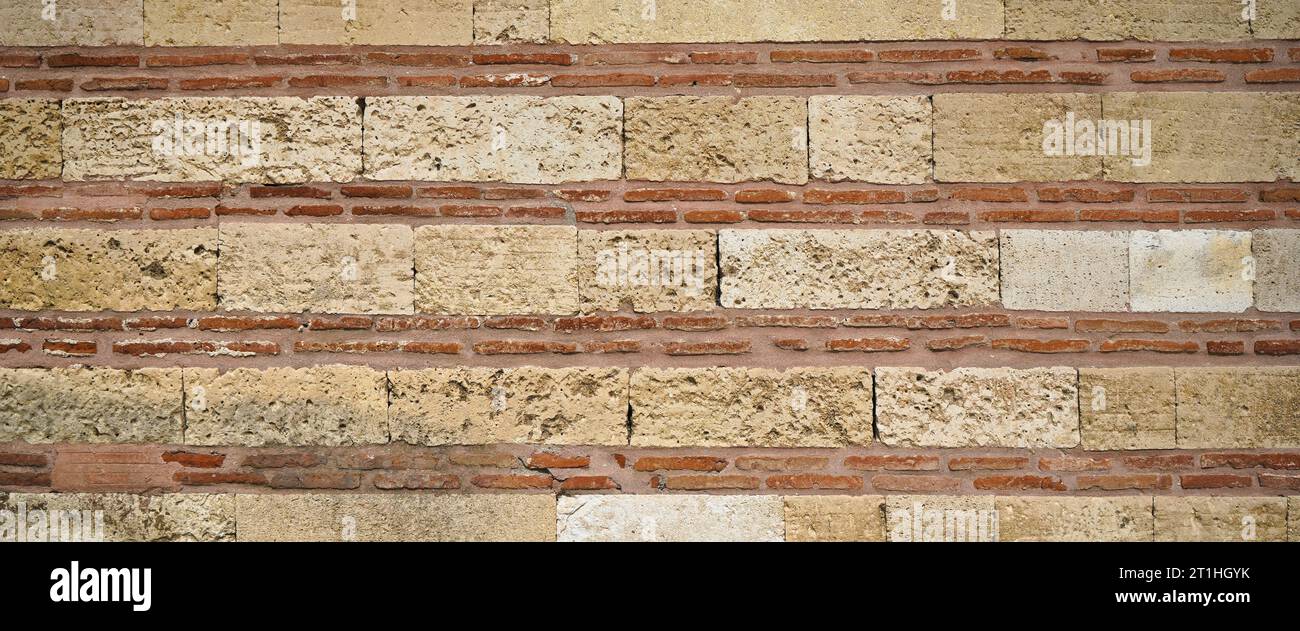 Sturdy yellow and beige cut stone brick wall, good for backgrounds ...