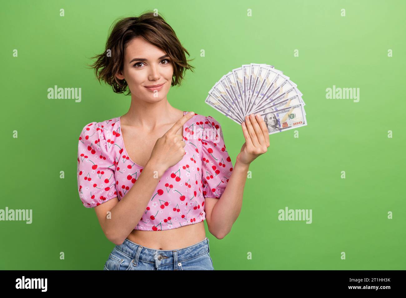 Photo of attractive young woman point banknotes money fan dressed ...