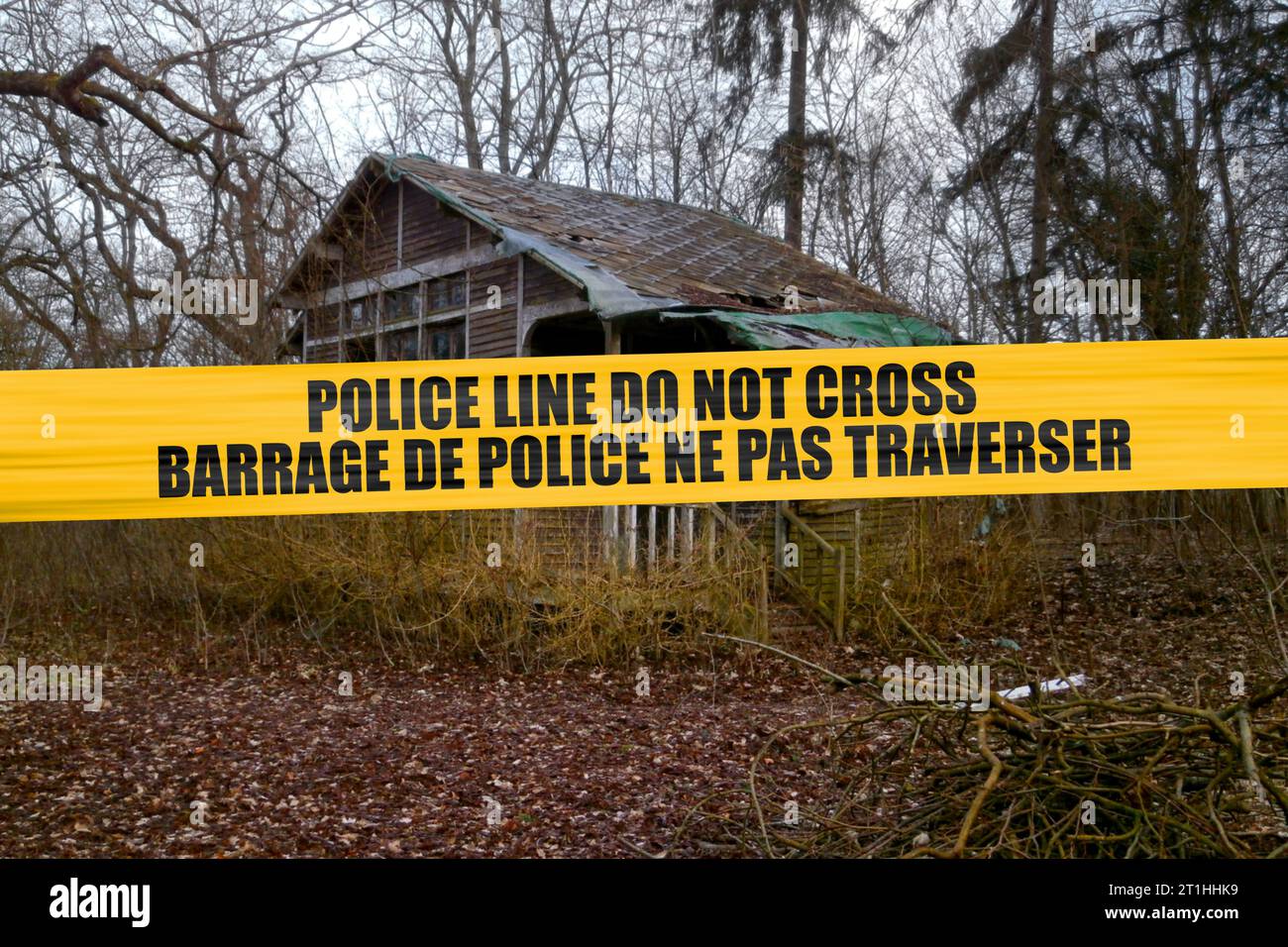 Abandoned cabin in the woods with a police tape with written in it in ...