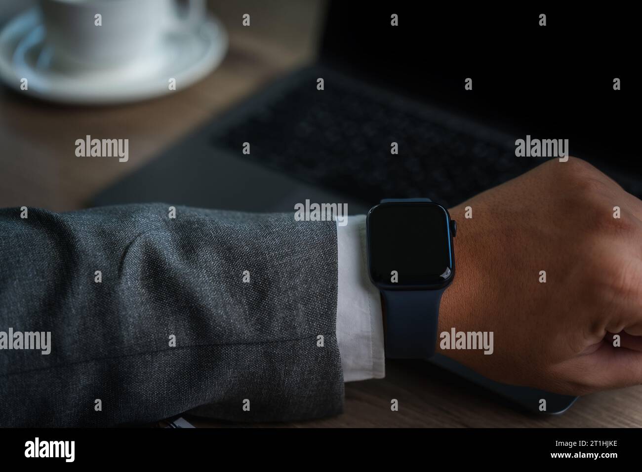 Man checking time on his smartwatch device Close-up display clock ...