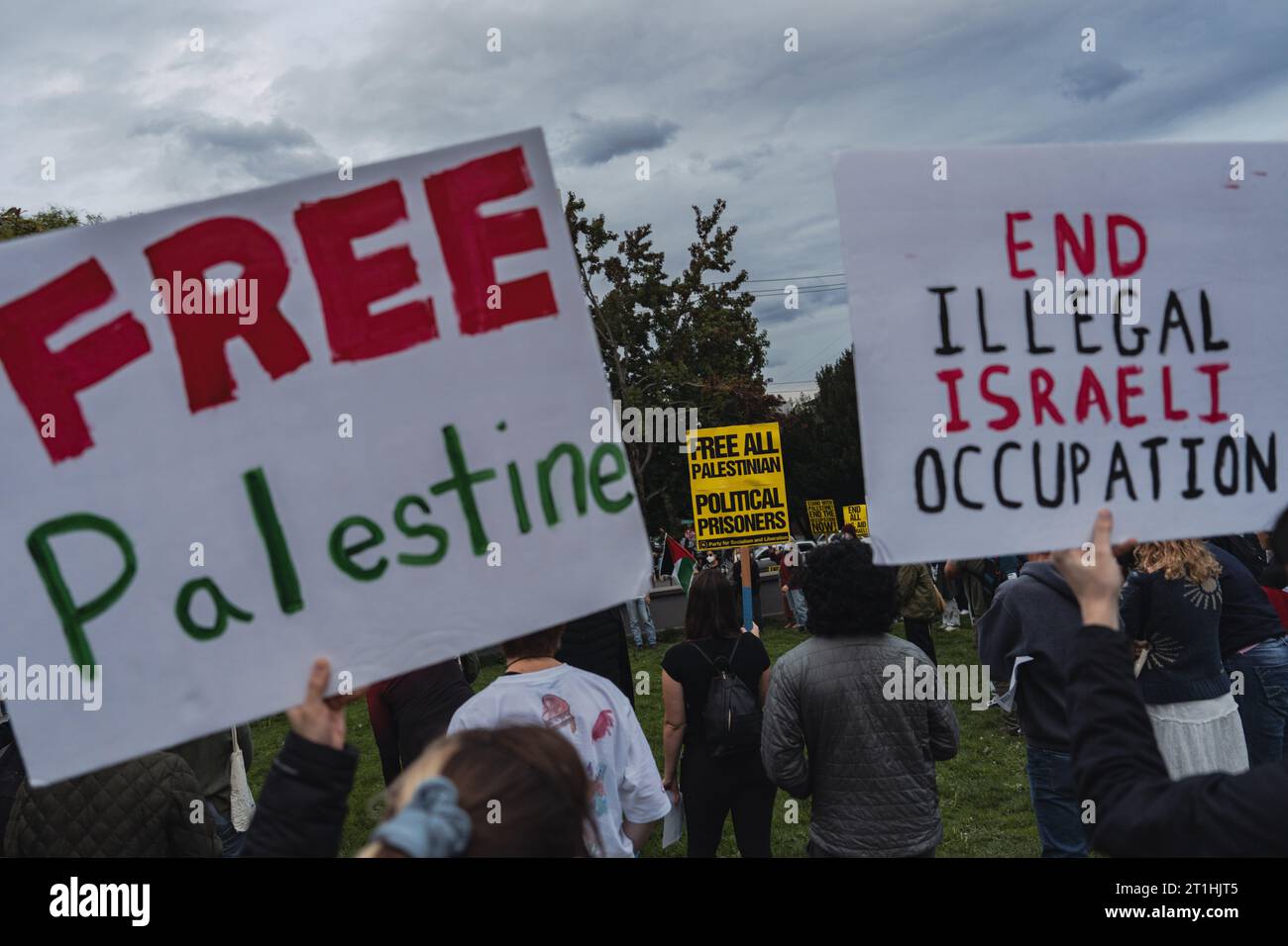 Protesters hold placards expressing their opinion during a ...