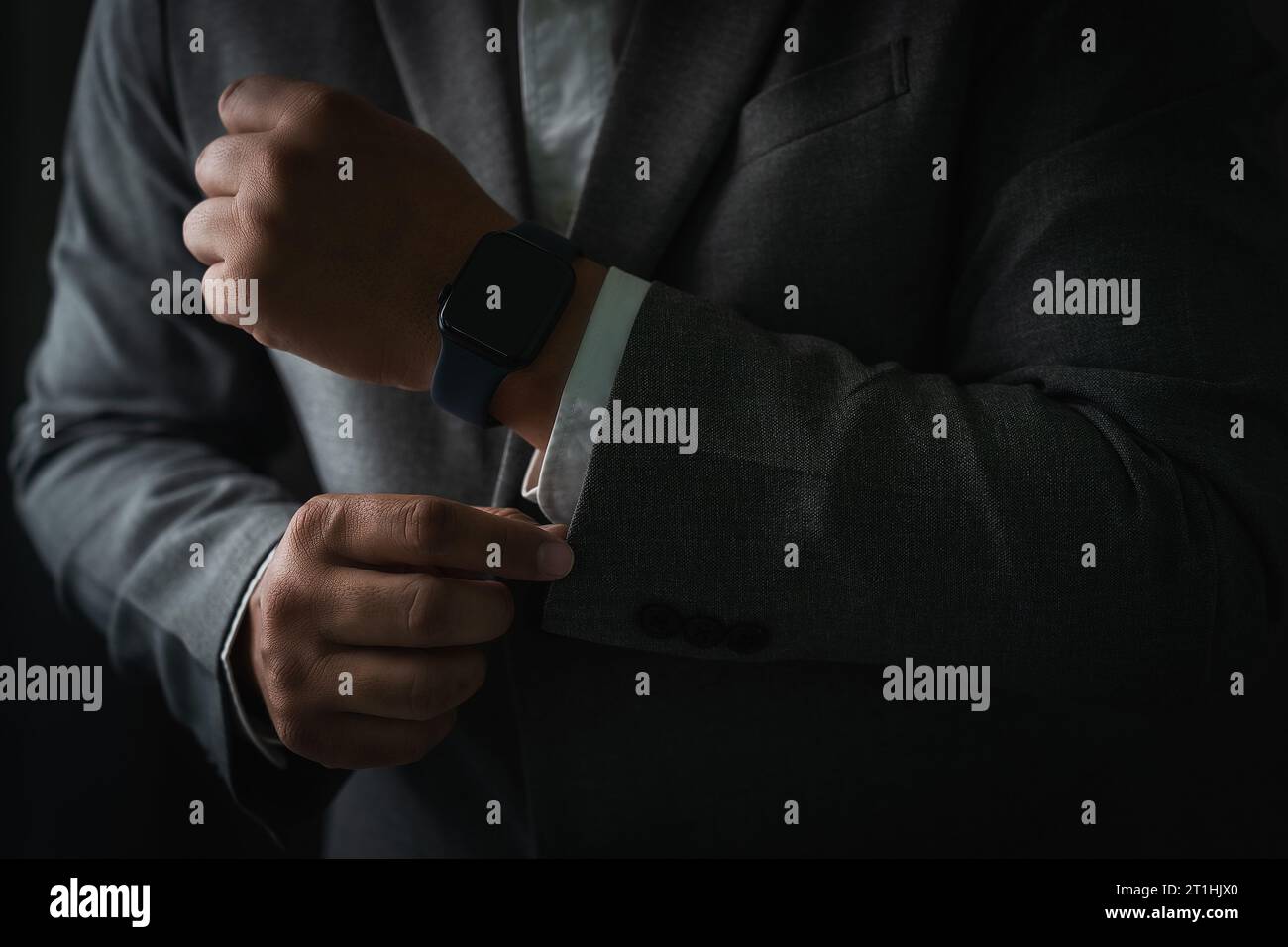 Man checking time on his smartwatch device Close-up display clock ...